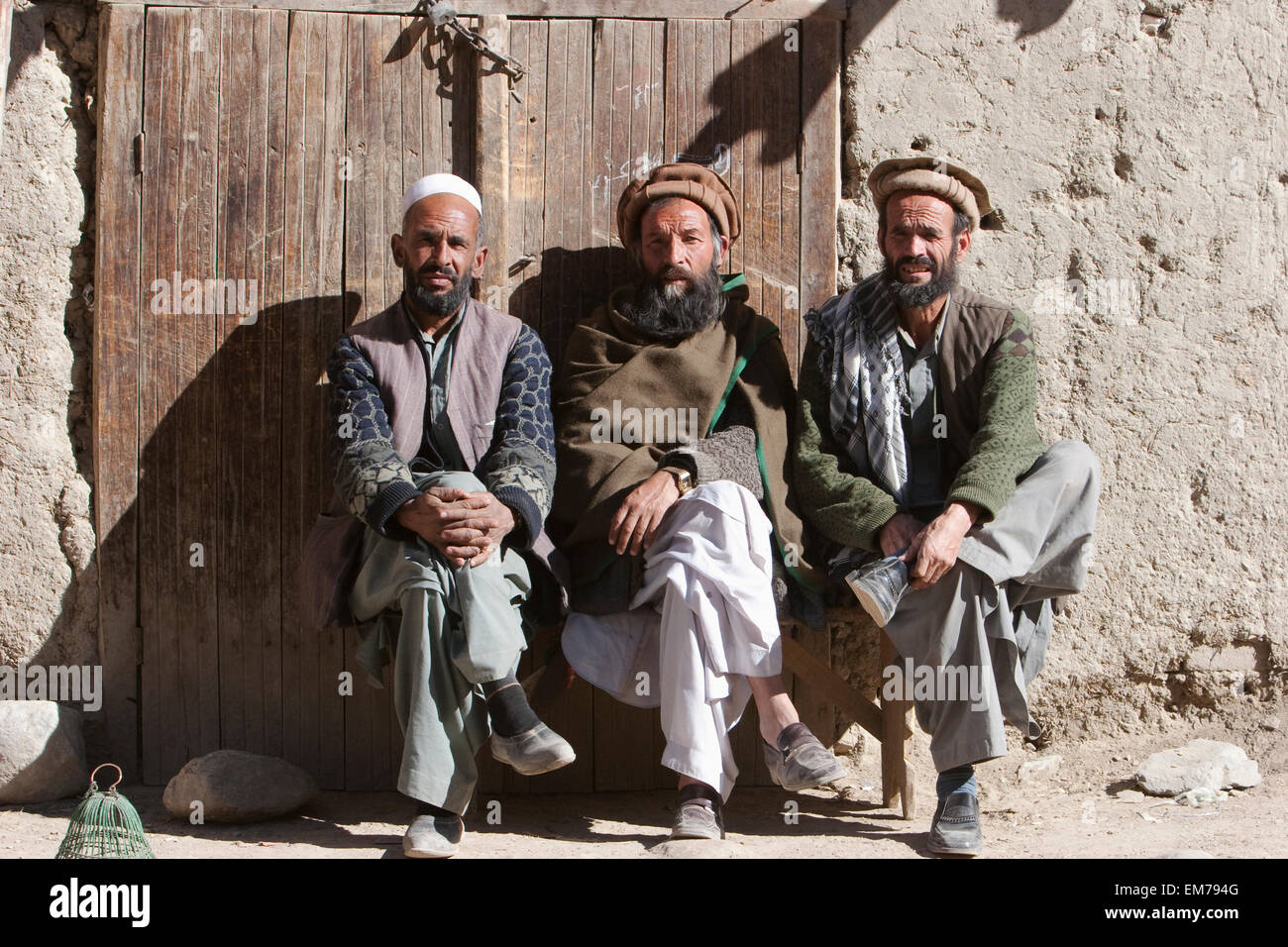 Afghan Men Sitting By A Door In Chahar Deh-Ye Ghowr Band, Parwan ...