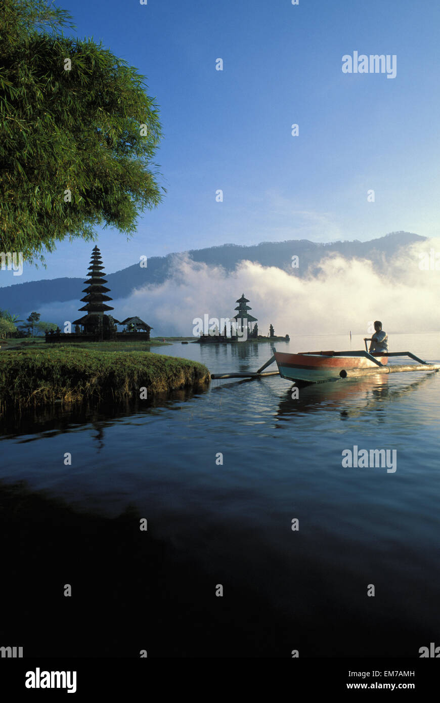 Indonesia, Bali, Ulu Danu Temple At Sunrise, Canoe Paddling On Water No ...