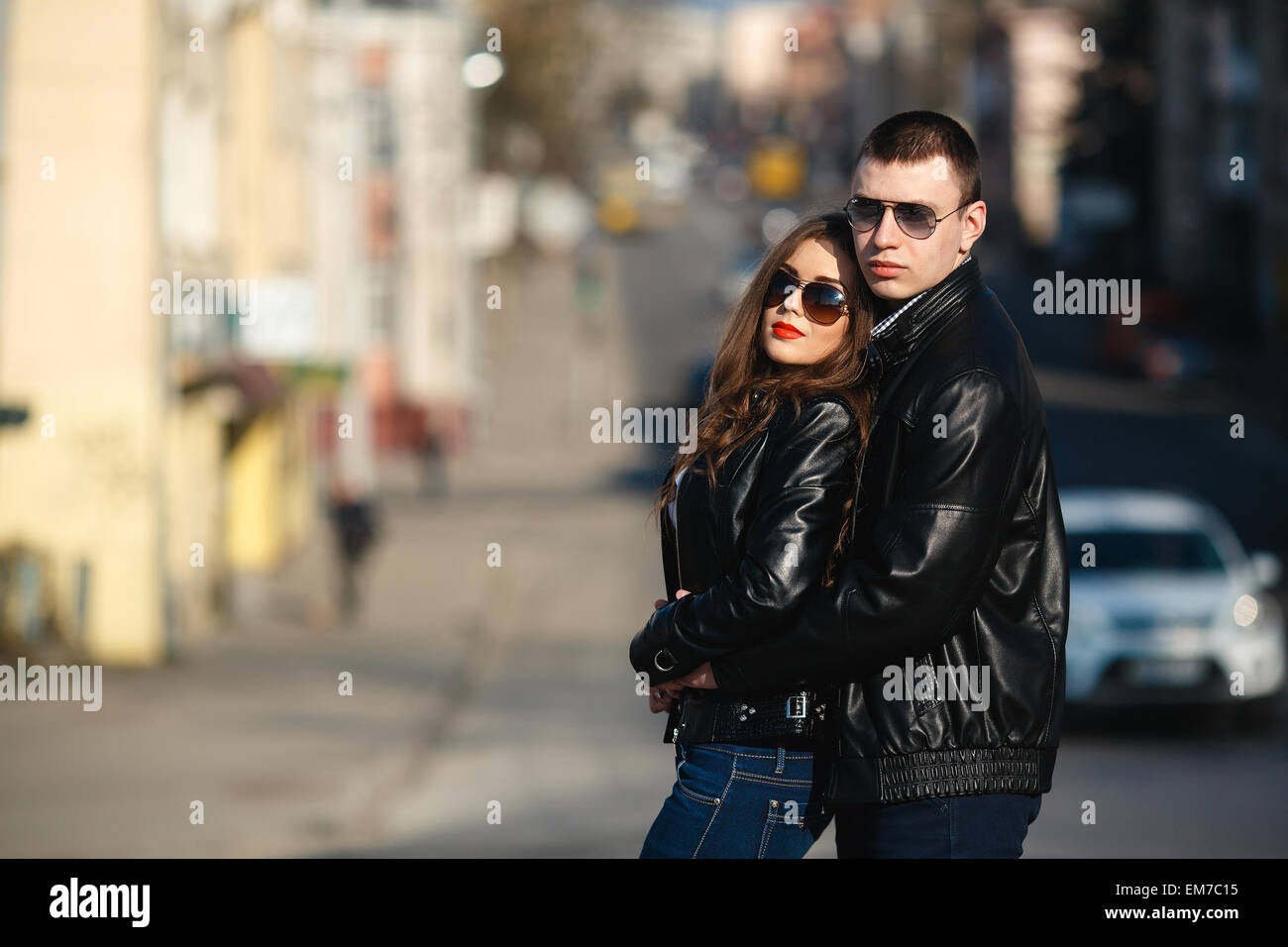 beautiful couple posing on a city street Stock Photo - Alamy