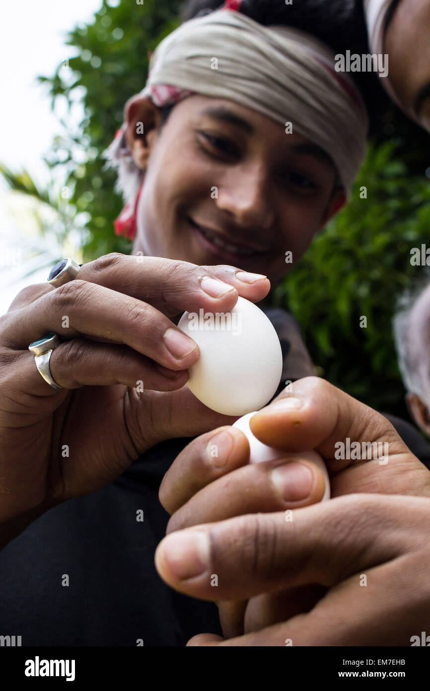 Sivasagar, Assam, India. 17th Apr, 2015. Youths take part in an egg ...