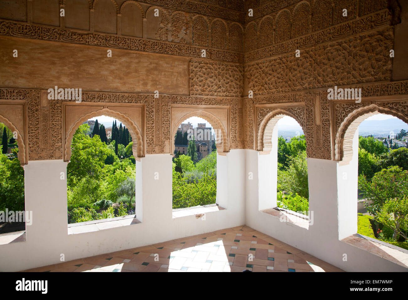 Arched decorated Moorish stone windows looking over gardens, Generalife ...