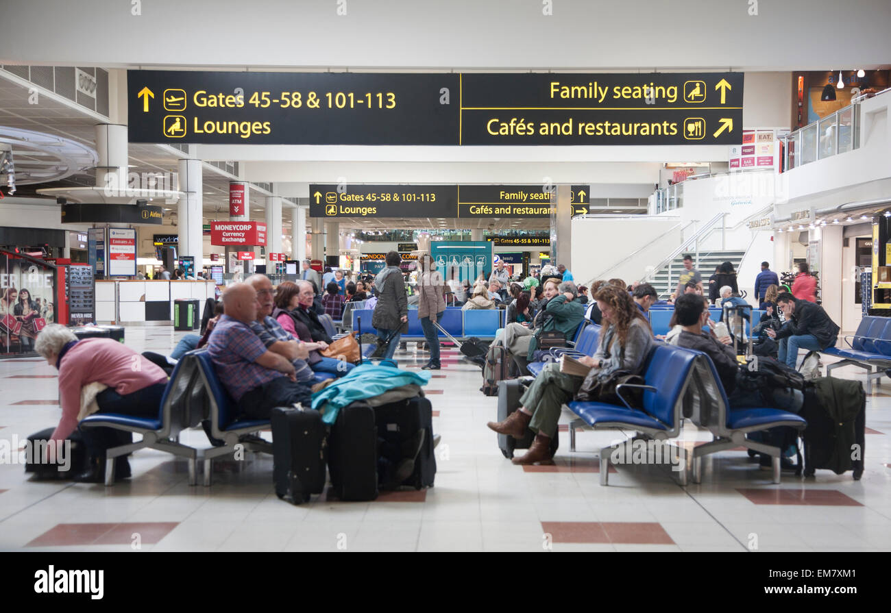 People waiting in departure lounge at Gatwick airport, England Stock ...