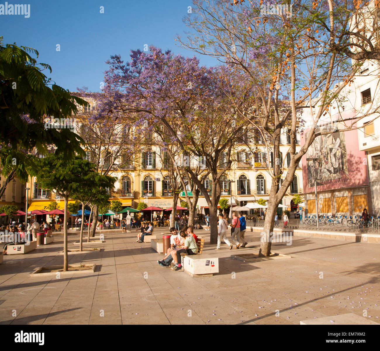 People enjoying a sunny spring afternoon in Plaza de la Merced, Malaga ...