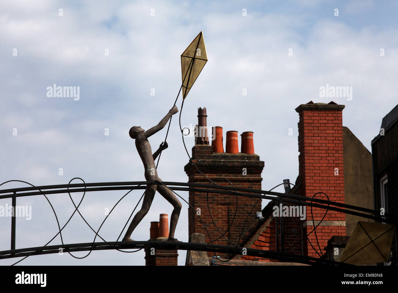 The Kite Flyer sculpture above Parchment Street in Winchester. A bronze ...