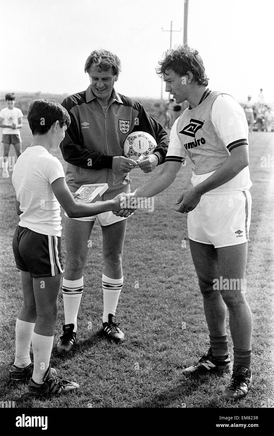 England captain Bryan Robson shakes hands with one of the boys of the ...