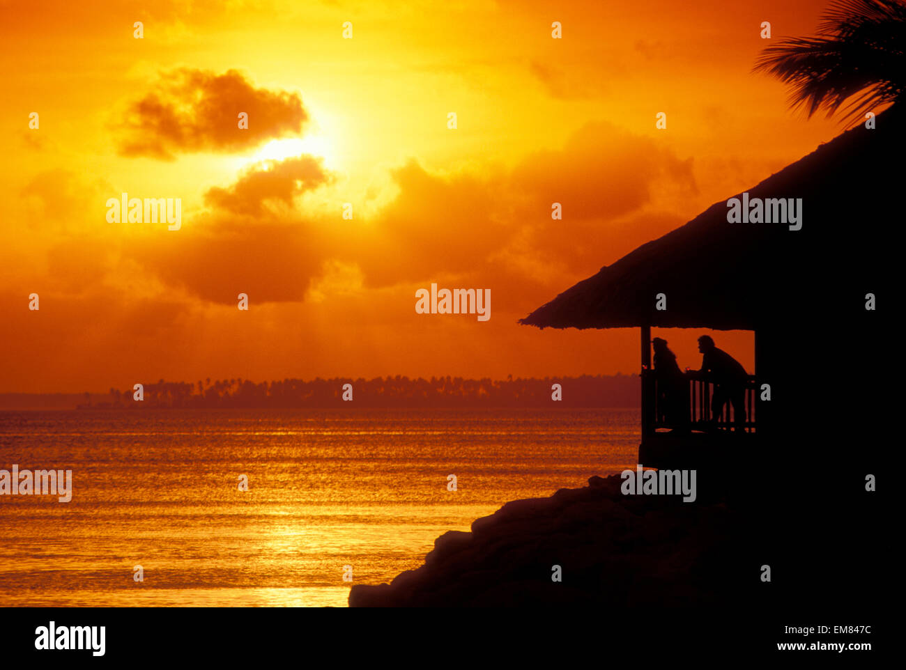 Marshall Islands, Majuro Atoll, Couple Watch Sunset From Porch Stock ...