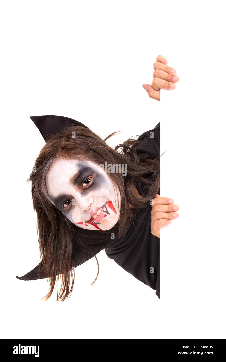 Girl with face-paint and Halloween vampire costume over a white board ...