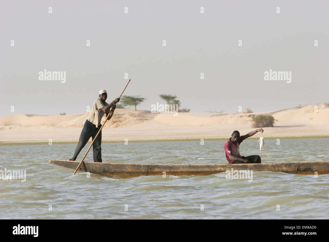 Fishermen on a boat on the Niger River between Niafunke and Kabara ...