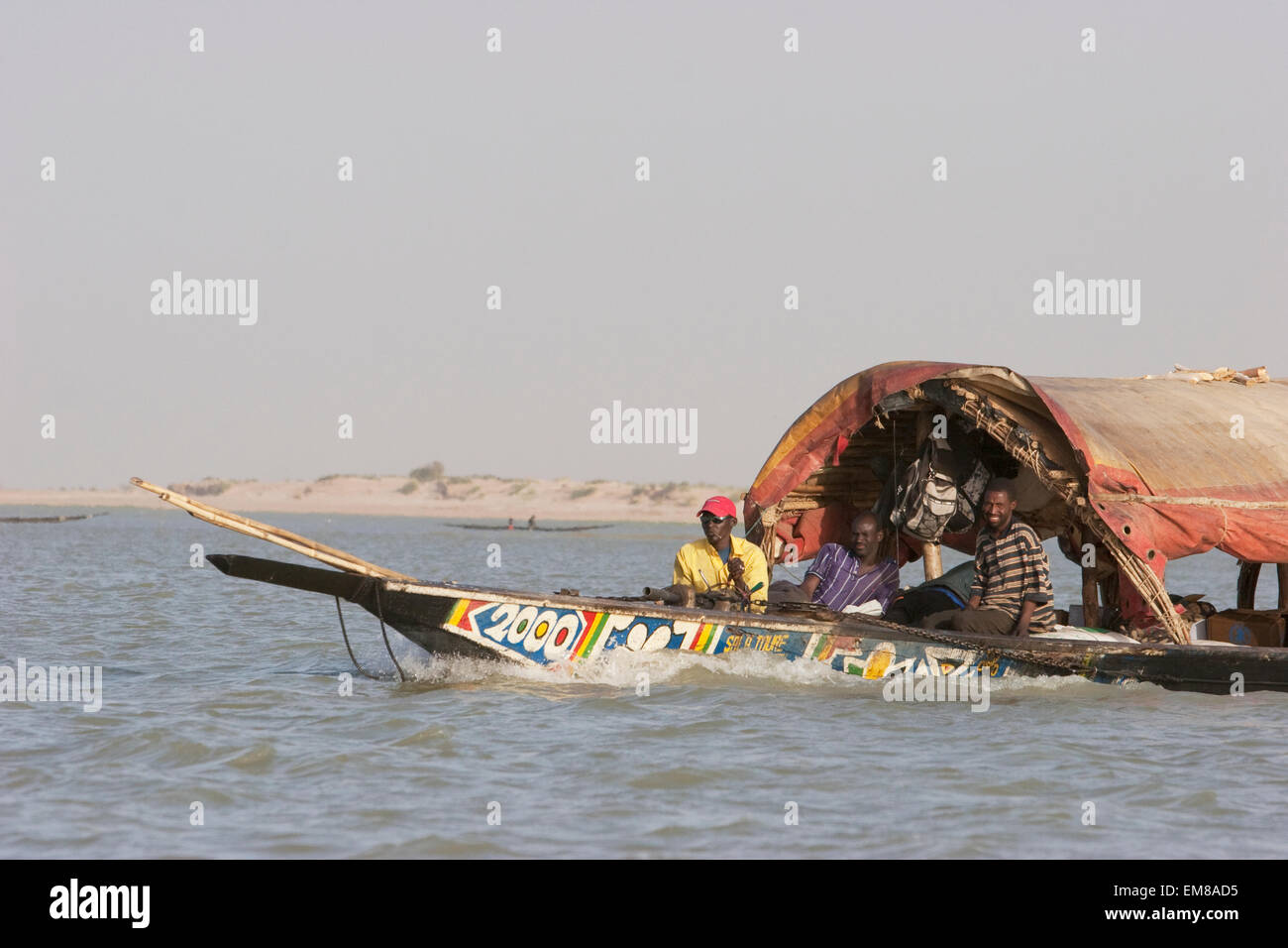 Pinasse carrying cargo and people on the Niger River between Niafunke ...