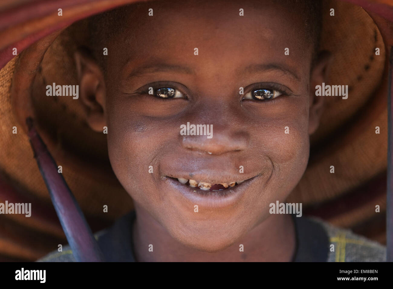 Dogon boy wearing a hat in Tireli, Mali Stock Photo - Alamy