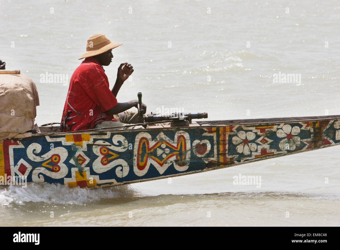 Captain of a Pinasse carrying cargo and passengers on the Niger River ...