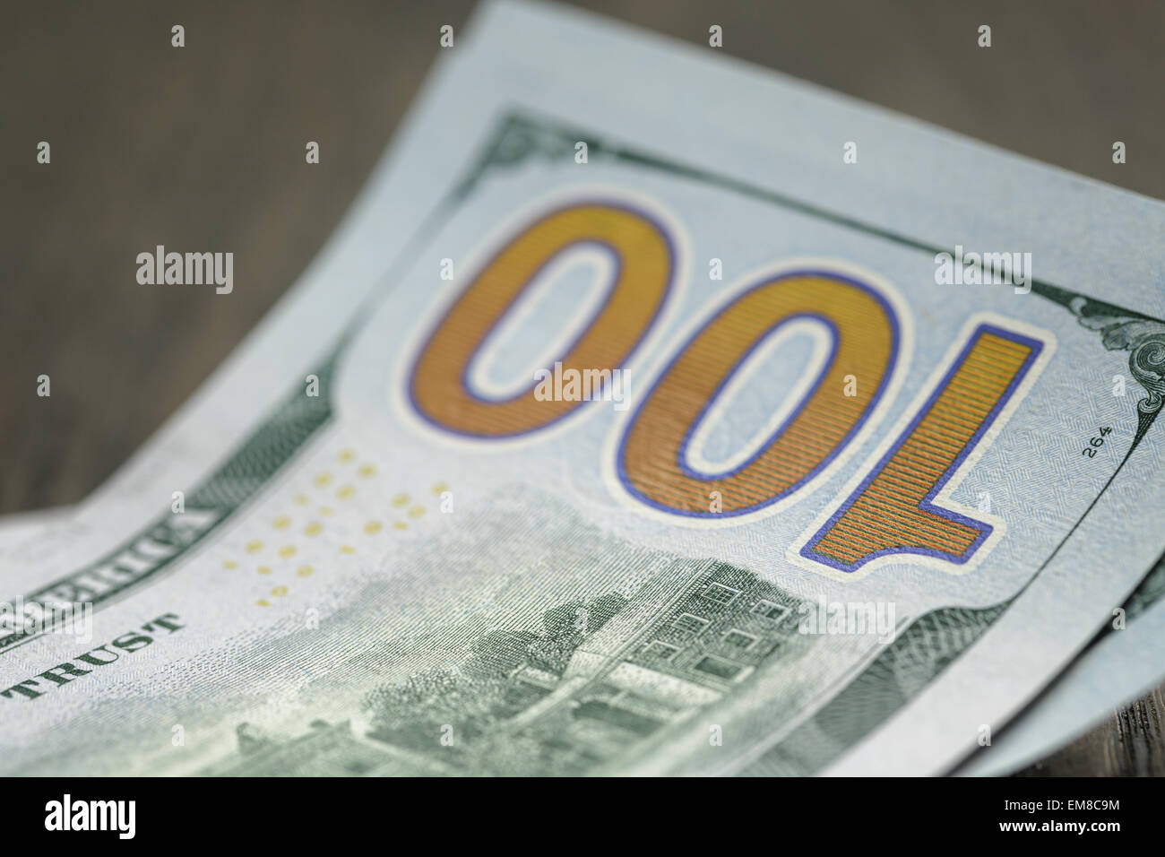 new hundred dollar bills on wood table Stock Photo - Alamy