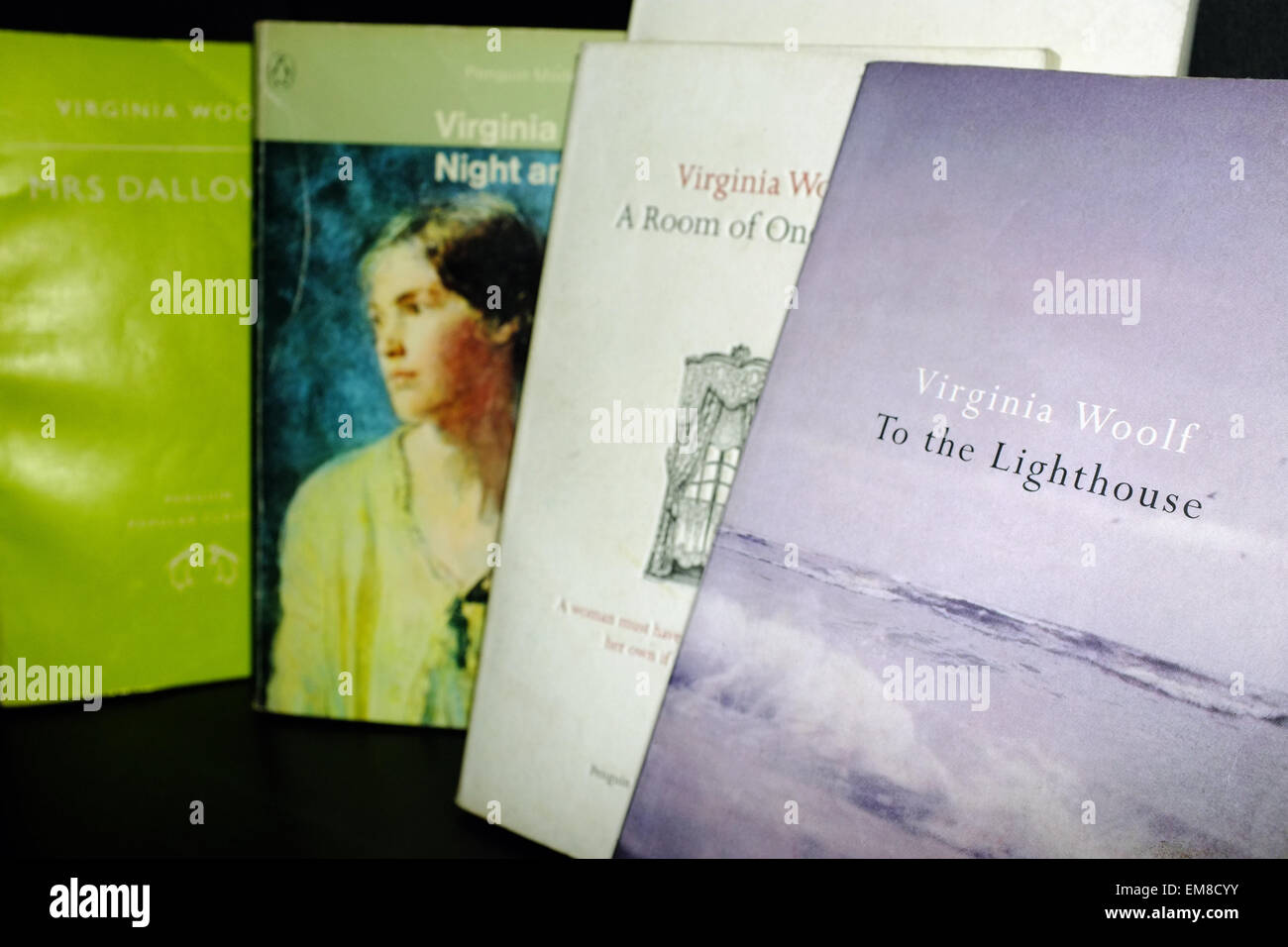 A collection of Virginia Woolf book covers photographed against a black ...