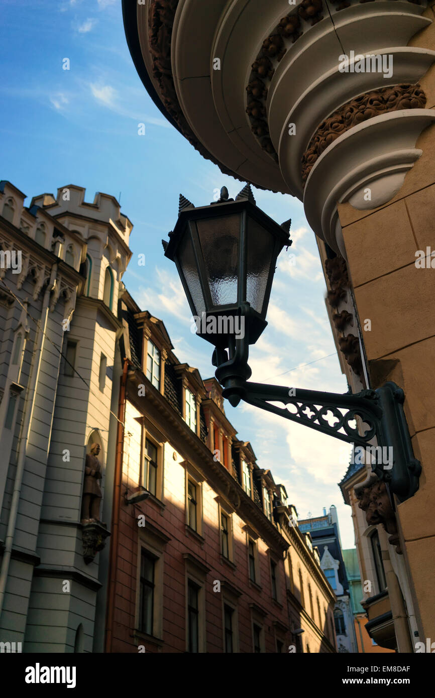 Street lamp on the facade of an old building on the street Guild Riga ...