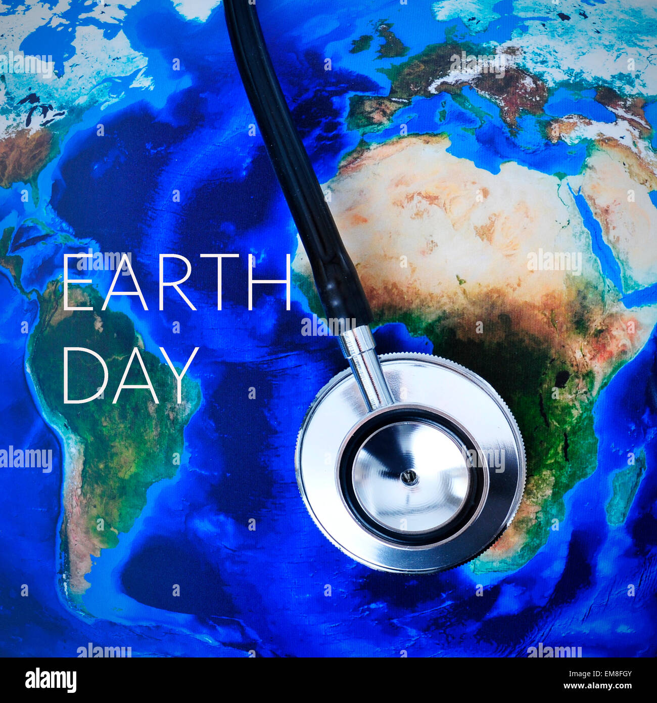 closeup of a stethoscope on a world map (furnished by NASA) and the ...