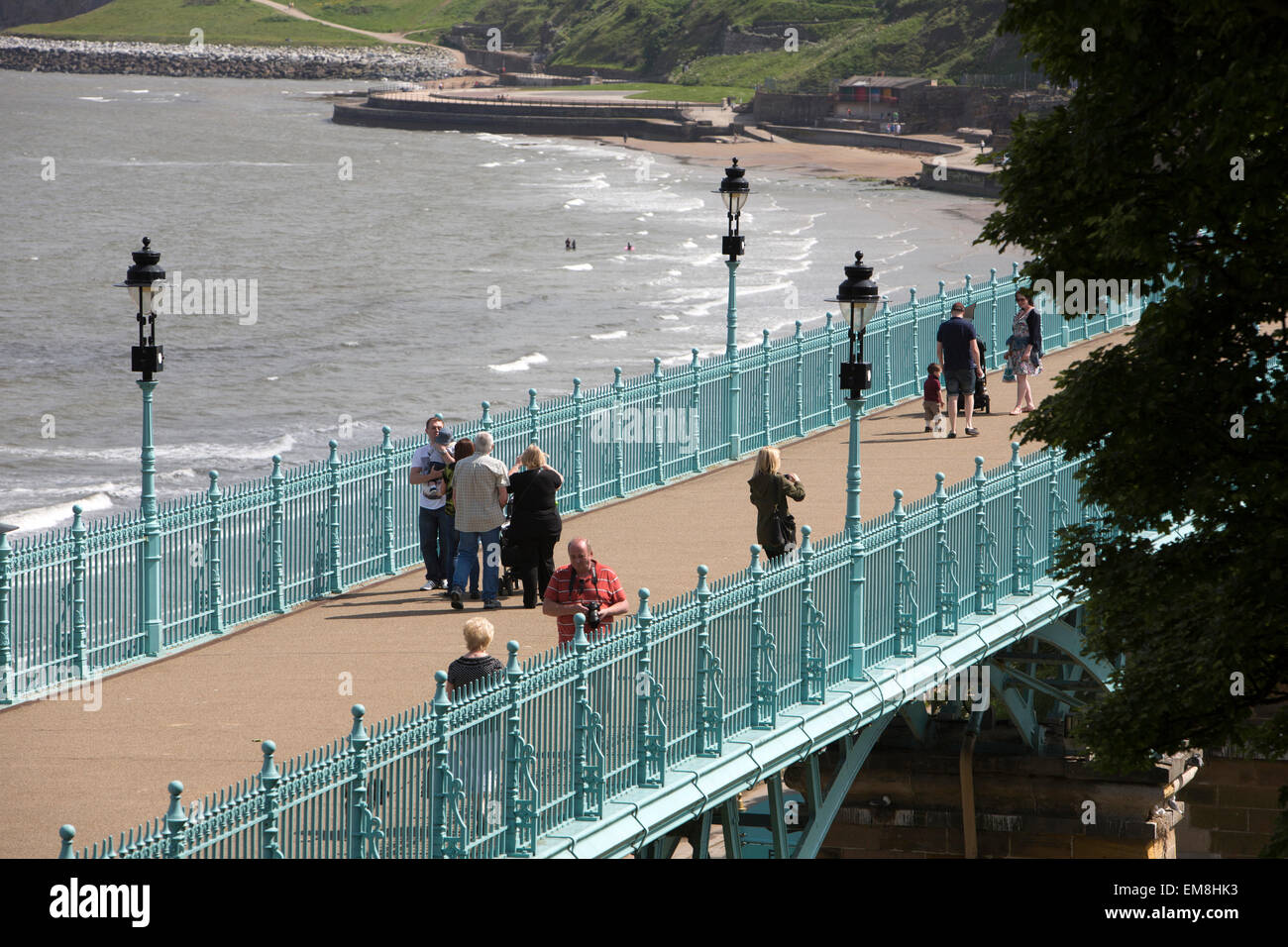 UK, England, Yorkshire, Scarborough, visitors walking on Cliff Bridge ...