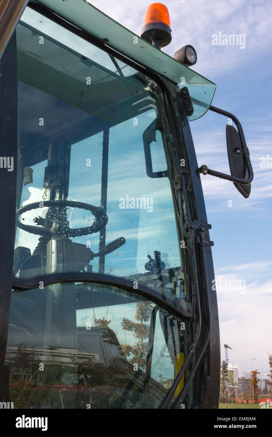 Close-up of loader excavator cabin with hazard lights Stock Photo - Alamy