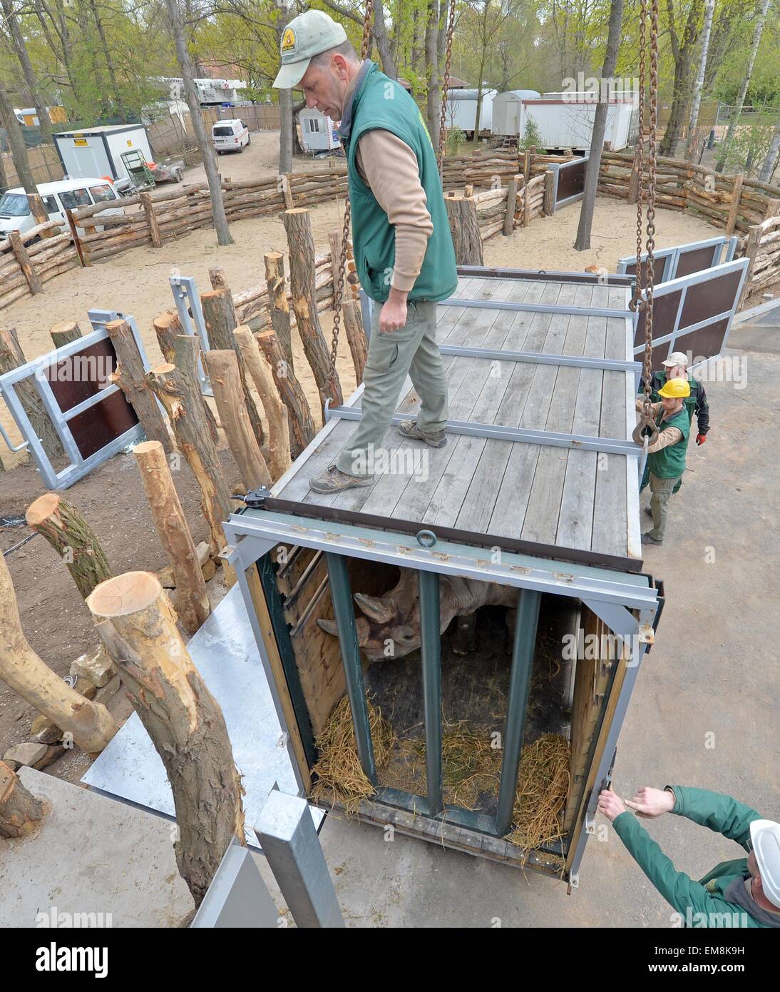 Leipzig, Germany. 17th Apr, 2015. A zookeeper threads a transport box ...