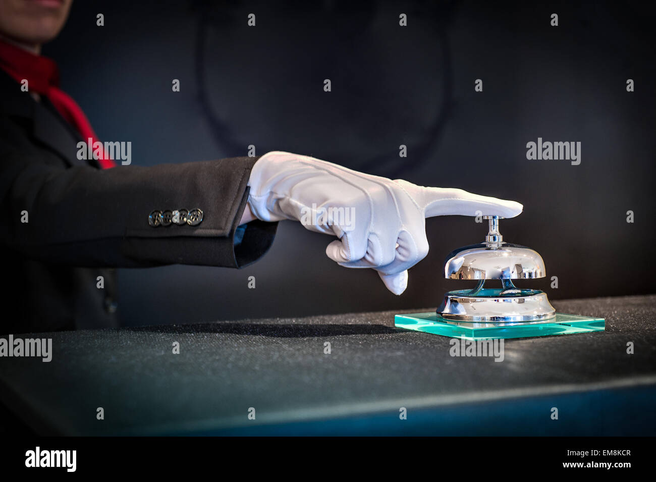 Concierge ringing reception bell Stock Photo - Alamy