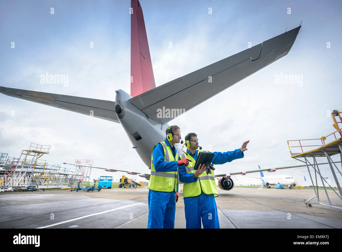 Inspecting jet aircraft on runway hi-res stock photography and images ...