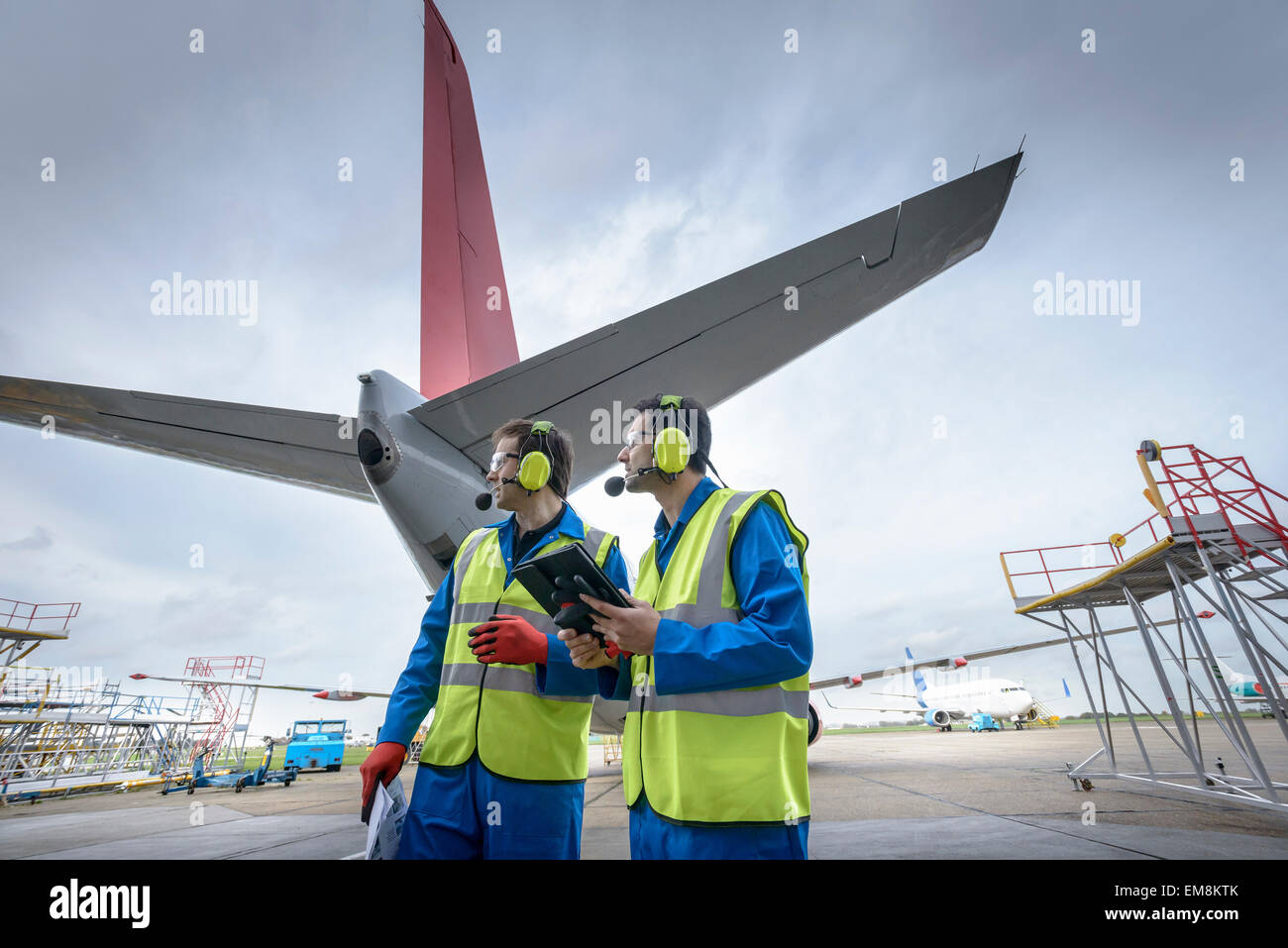 Inspecting jet aircraft on runway hi-res stock photography and images ...