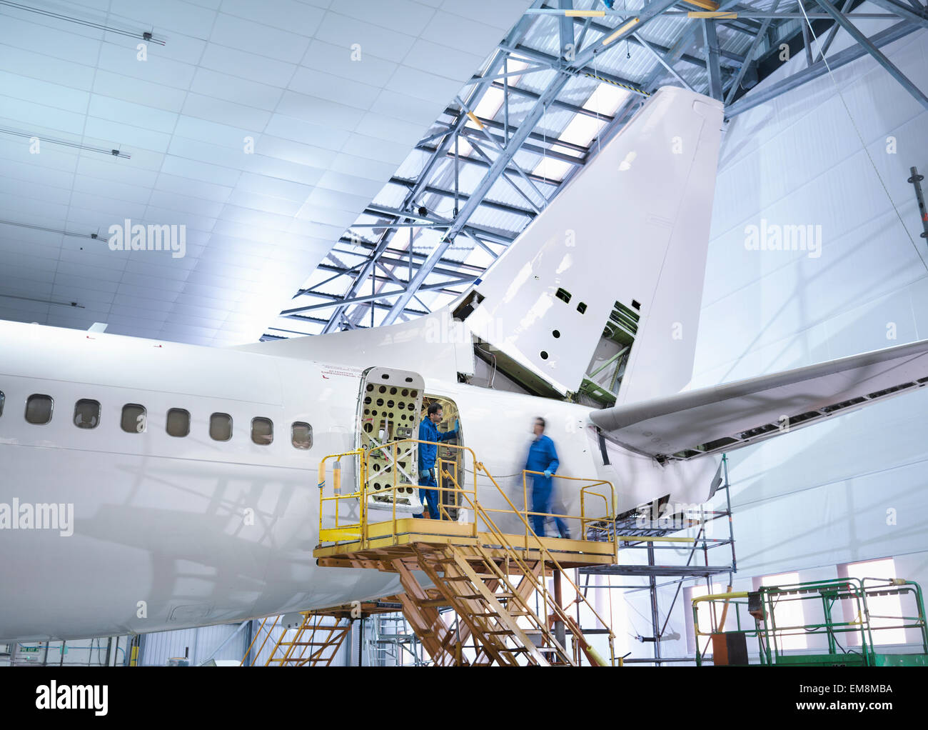 Engineers on scaffolding in aircraft hi-res stock photography and ...