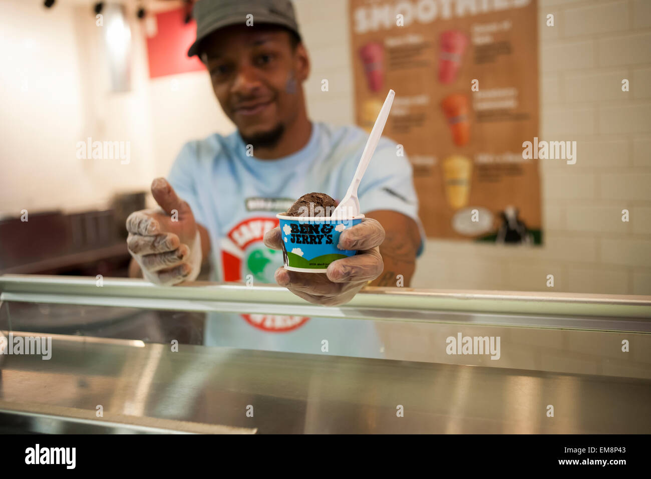 A counterperson gives away a cup of Chocolate Therapy ice cream in the ...