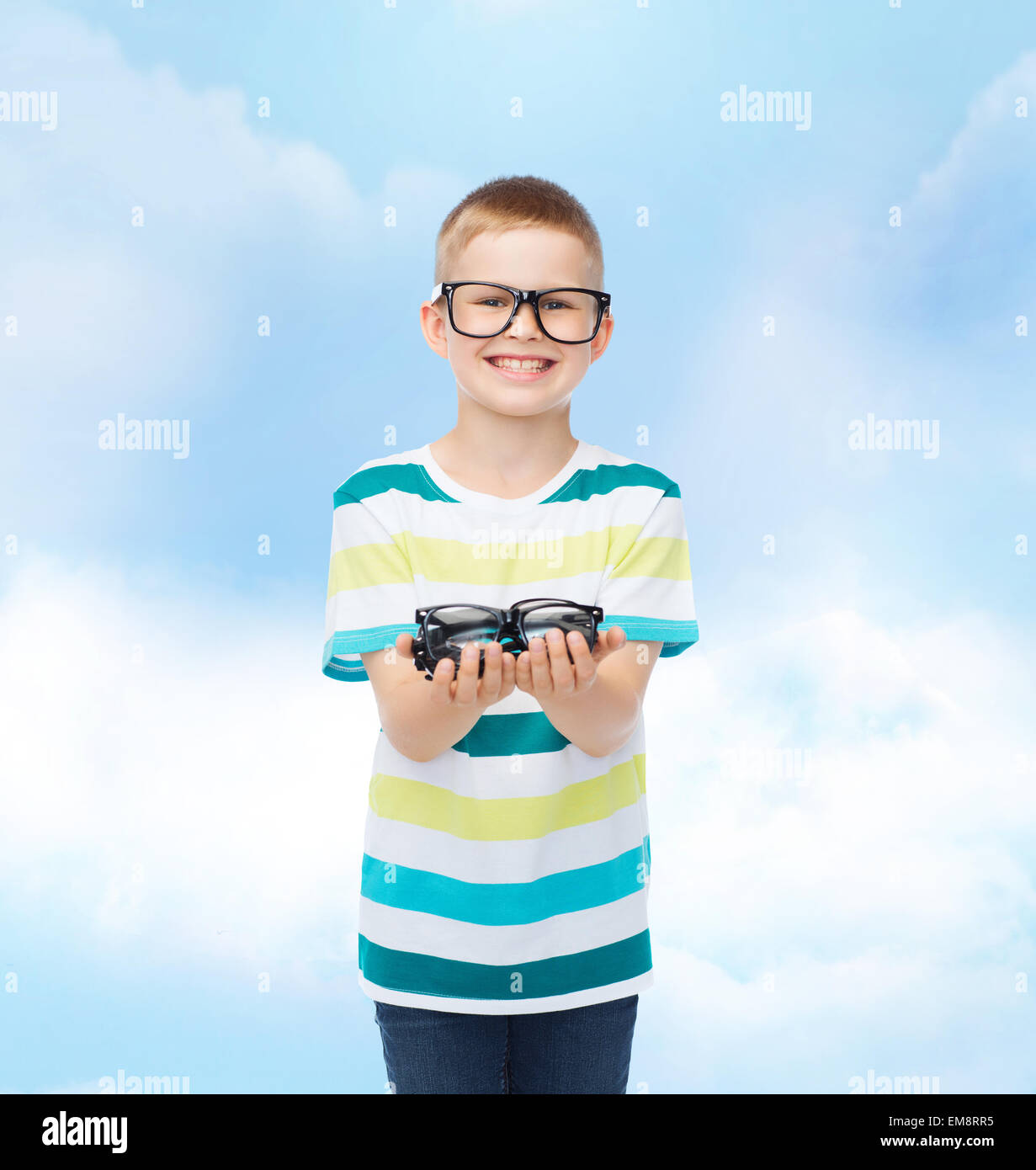 smiling boy in eyeglasses holding spectacles Stock Photo - Alamy