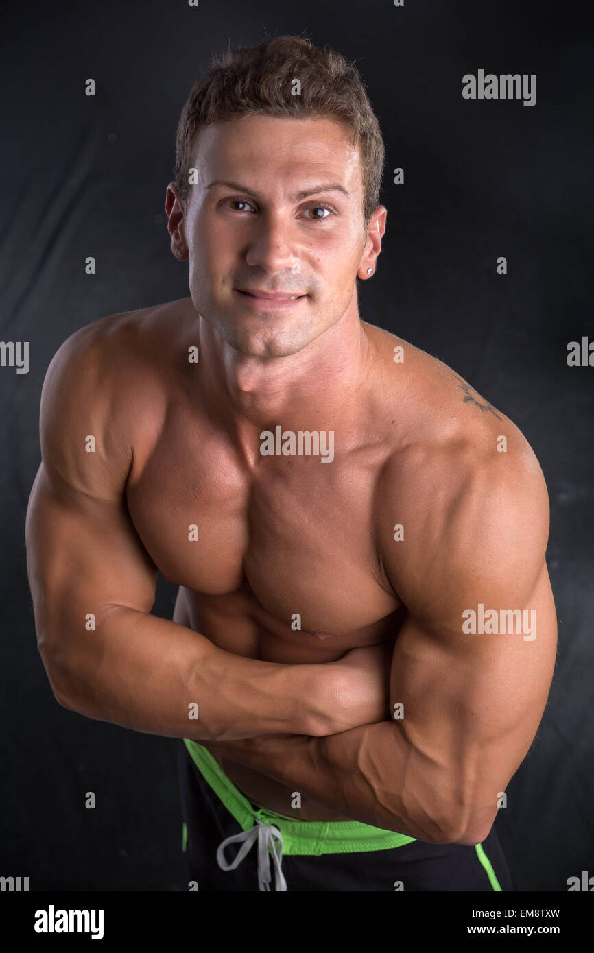 Handsome shirtless bodybuilder shot from above, standing Stock Photo ...