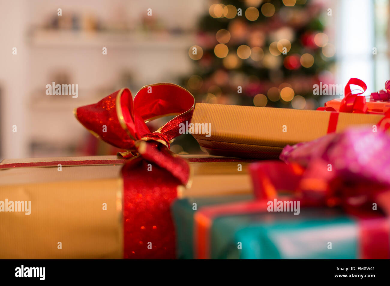 Close up of three christmas gifts with ribbons Stock Photo - Alamy