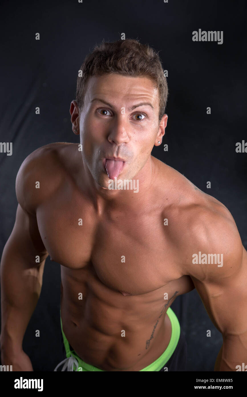Handsome shirtless bodybuilder shot from above, standing Stock Photo ...
