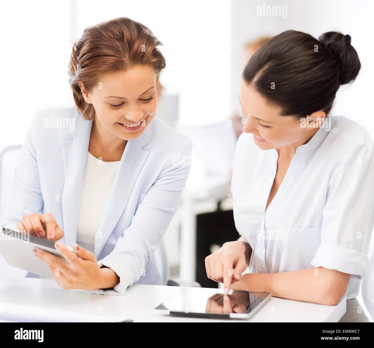 business team working with tablet pc in office Stock Photo - Alamy