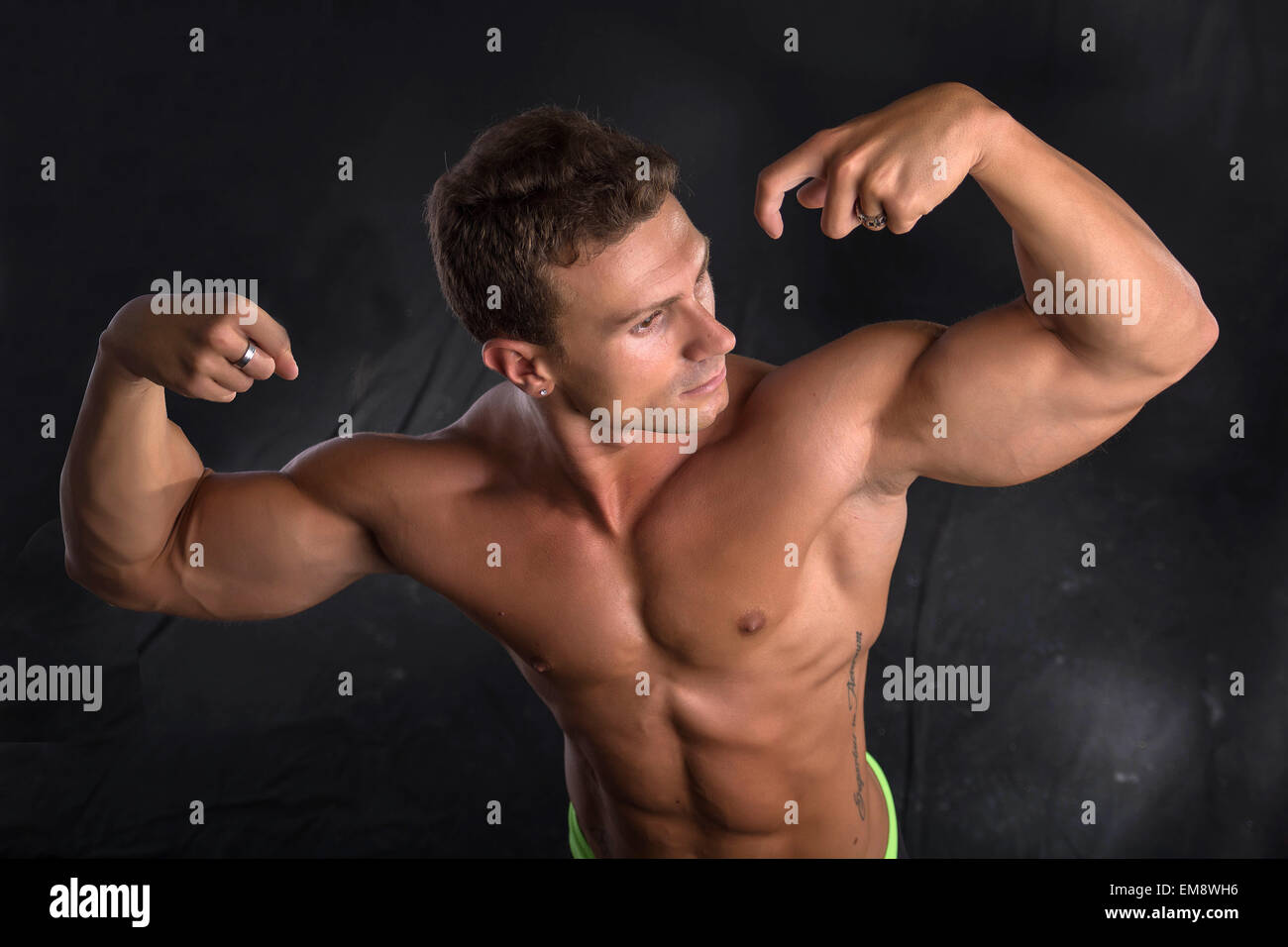 Handsome shirtless bodybuilder shot from above, standing Stock Photo ...