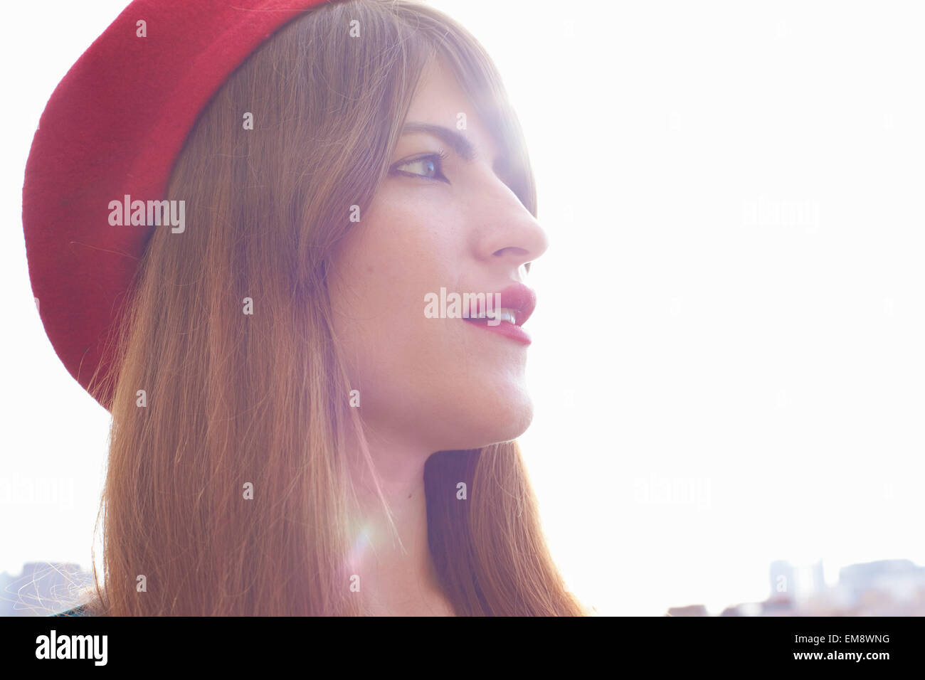 Portrait of woman wearing red hat Stock Photo - Alamy