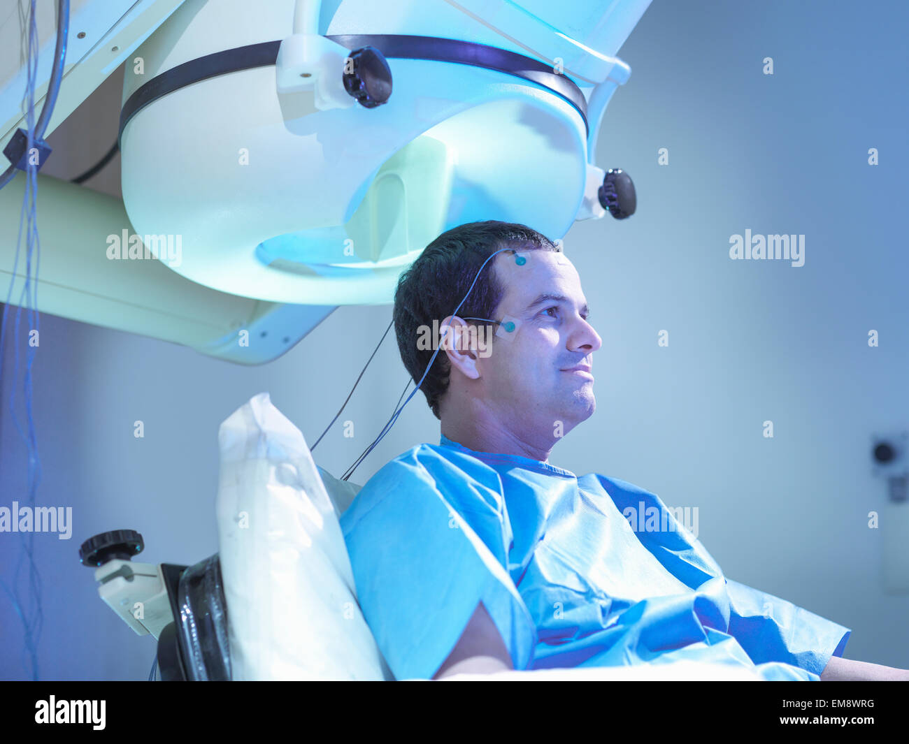 Male patient in magnetoencephalography (MEG) scanner Stock Photo - Alamy