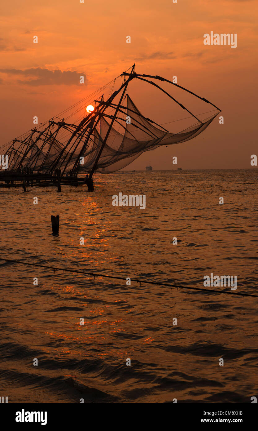 Sunset by the Chinese Fishing nets in Fort Kochi, Kerala India Stock ...