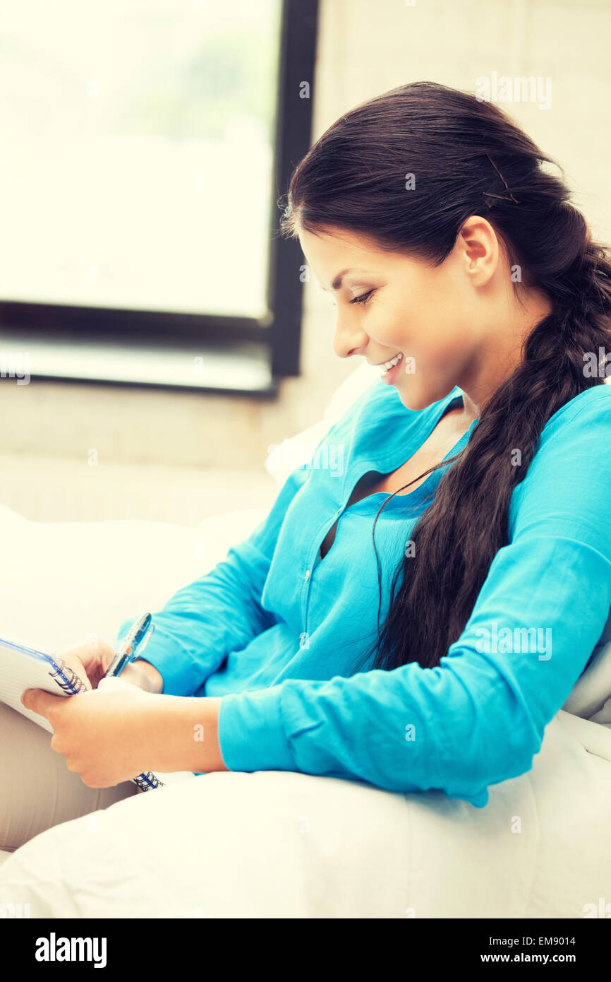 happy woman with big notepad Stock Photo - Alamy
