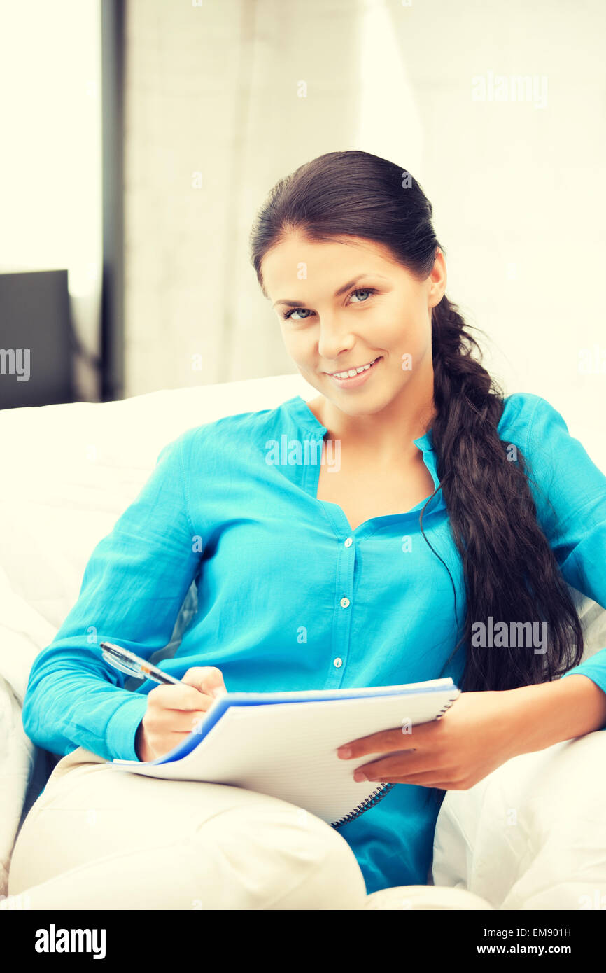 happy woman with big notepad Stock Photo - Alamy