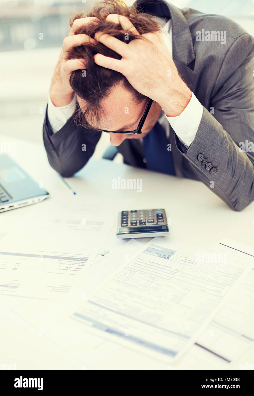 businessman with papres, laptop and calculator Stock Photo - Alamy