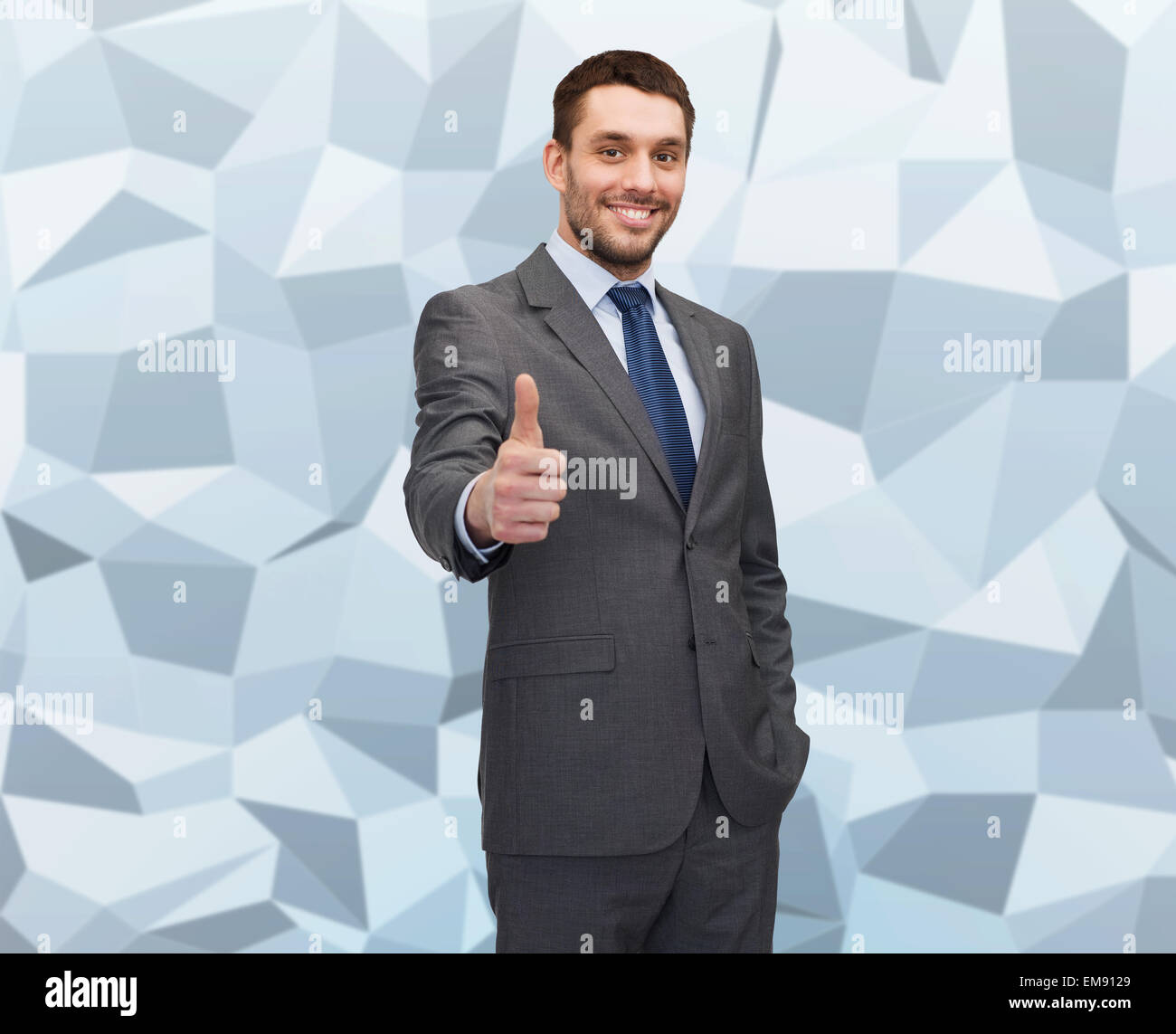 handsome businessman showing thumbs up Stock Photo - Alamy