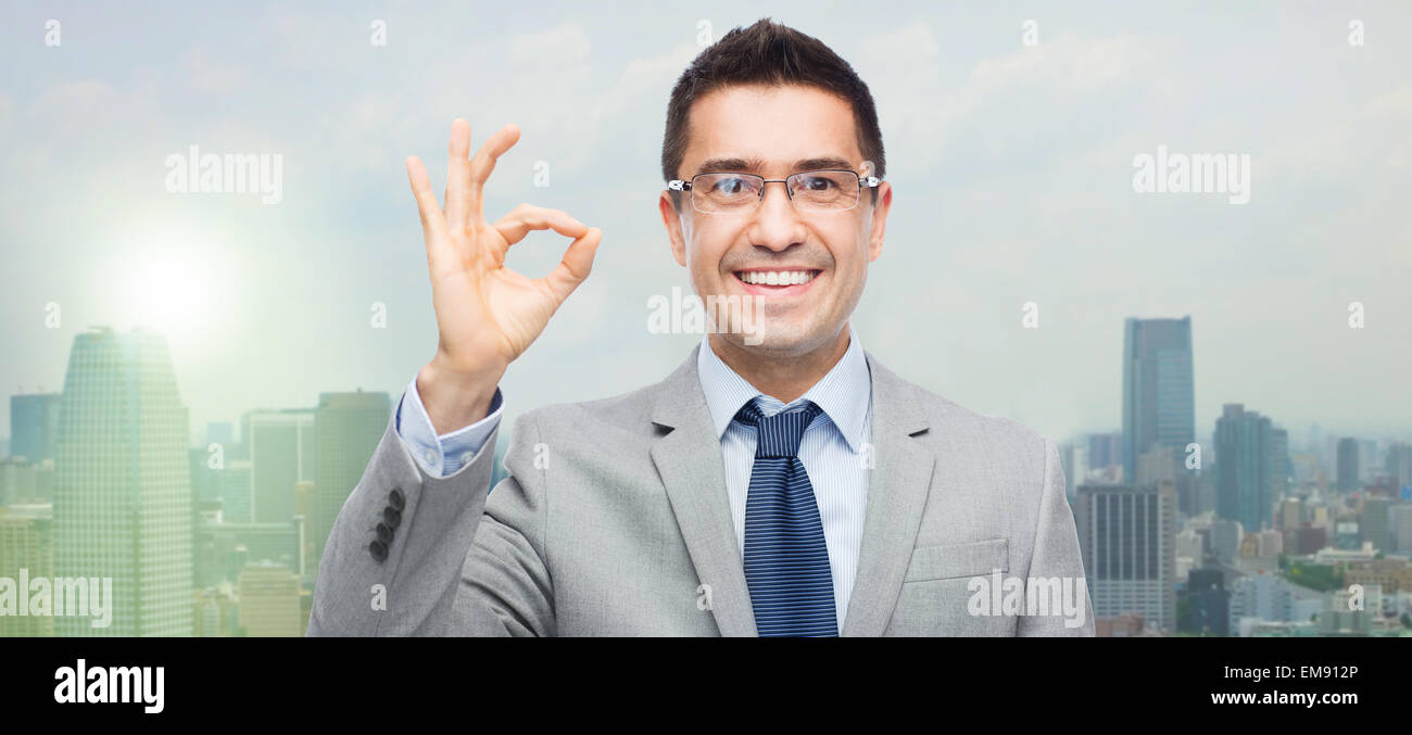 happy smiling businessman in eyeglasses and suit Stock Photo - Alamy