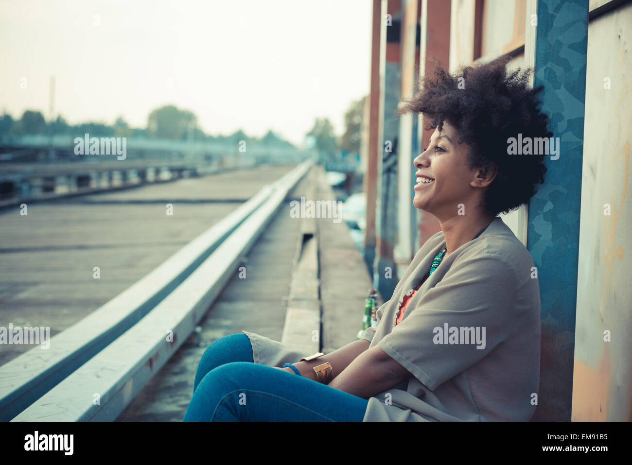 Woman Sitting Leaning Against Wall High Resolution Stock Photography ...