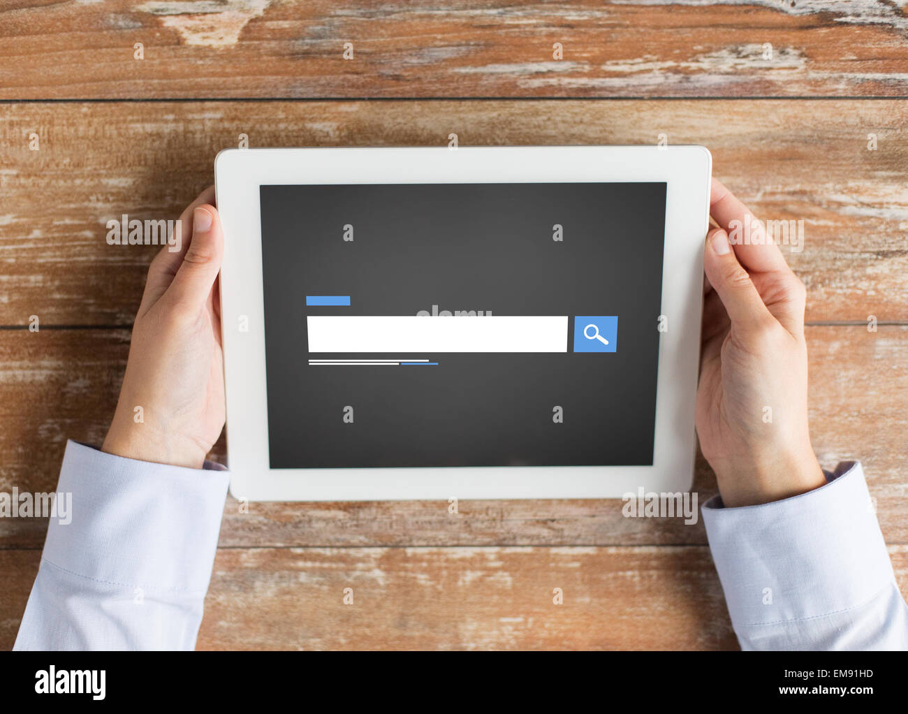 close up of male hands using browser on tablet pc Stock Photo - Alamy