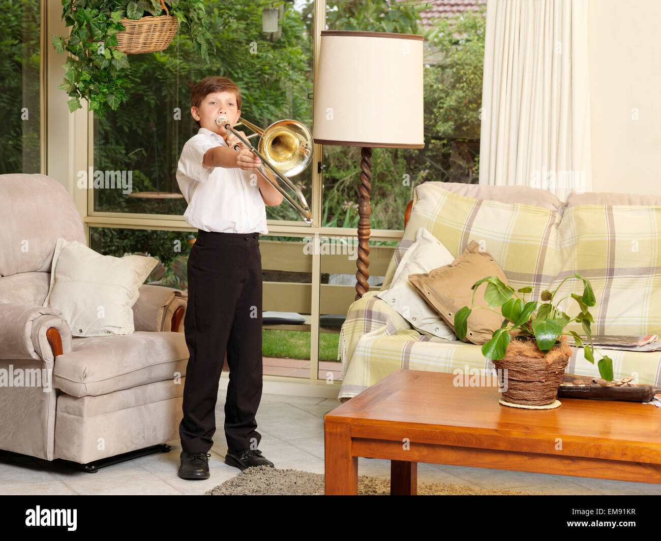 Children playing trombone hi-res stock photography and images - Alamy