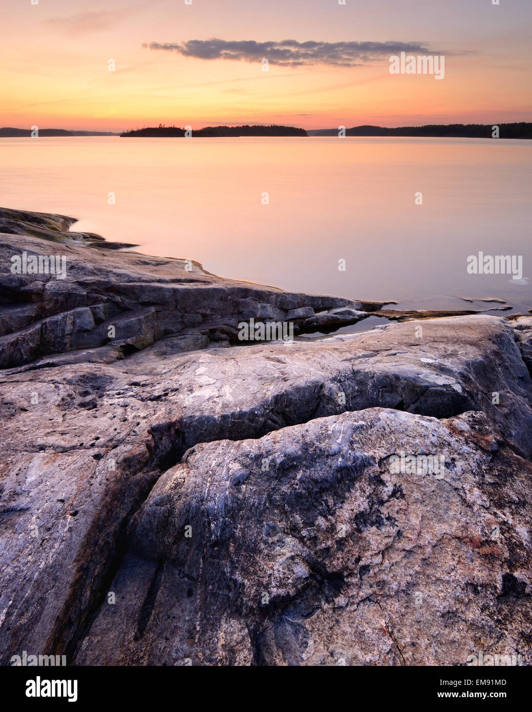 Lakeside rocks on Iso Koirasaari Island at sunset, Ladoga Lake ...