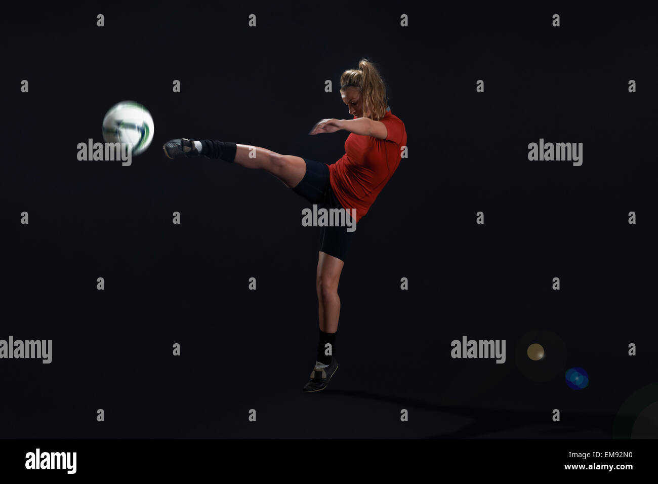 Footballer kicking ball hi-res stock photography and images - Alamy