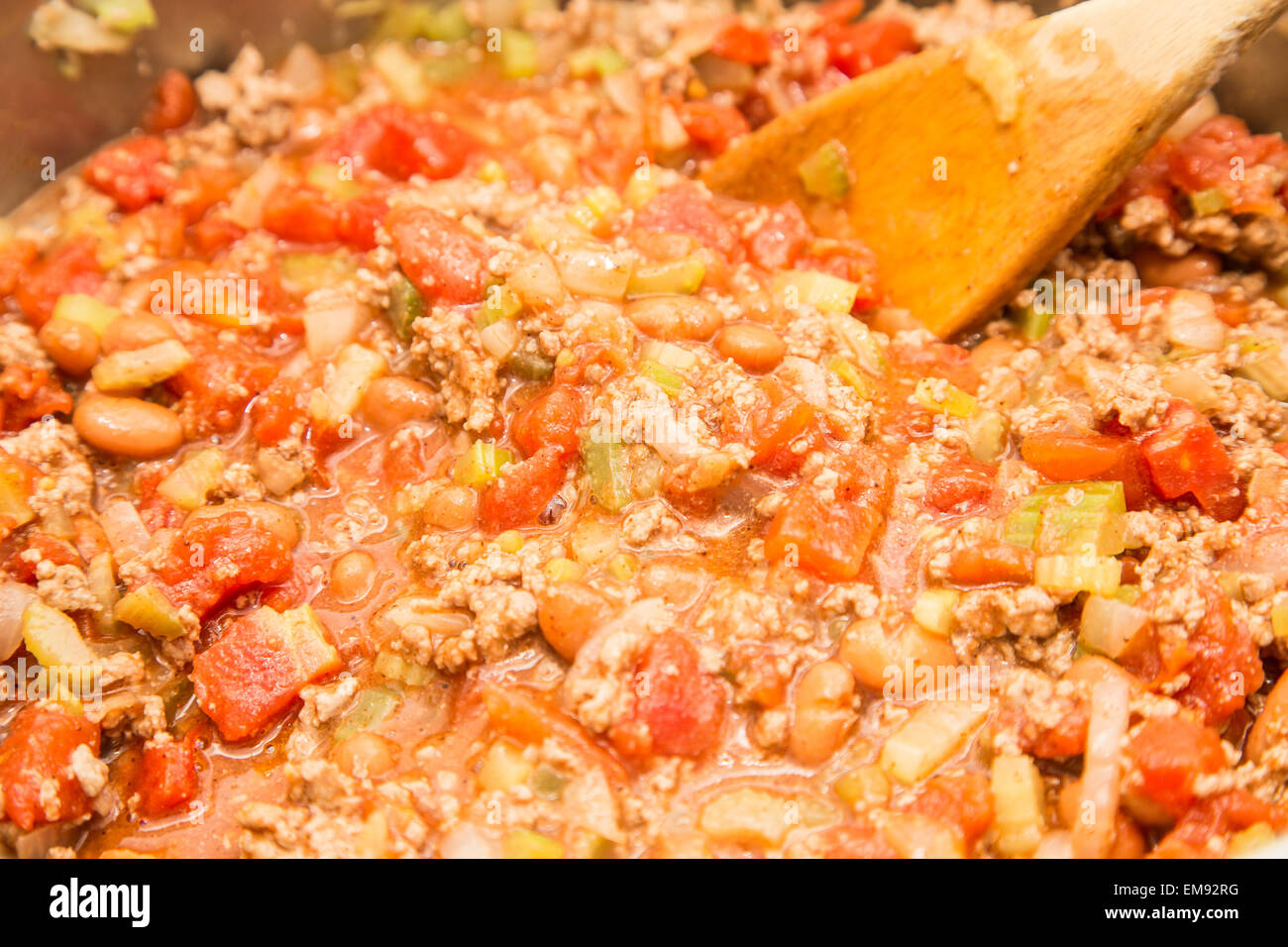 Cooking chili ingredients in a frying pan Stock Photo - Alamy
