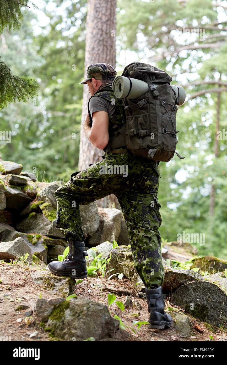 young soldier with backpack in forest Stock Photo - Alamy
