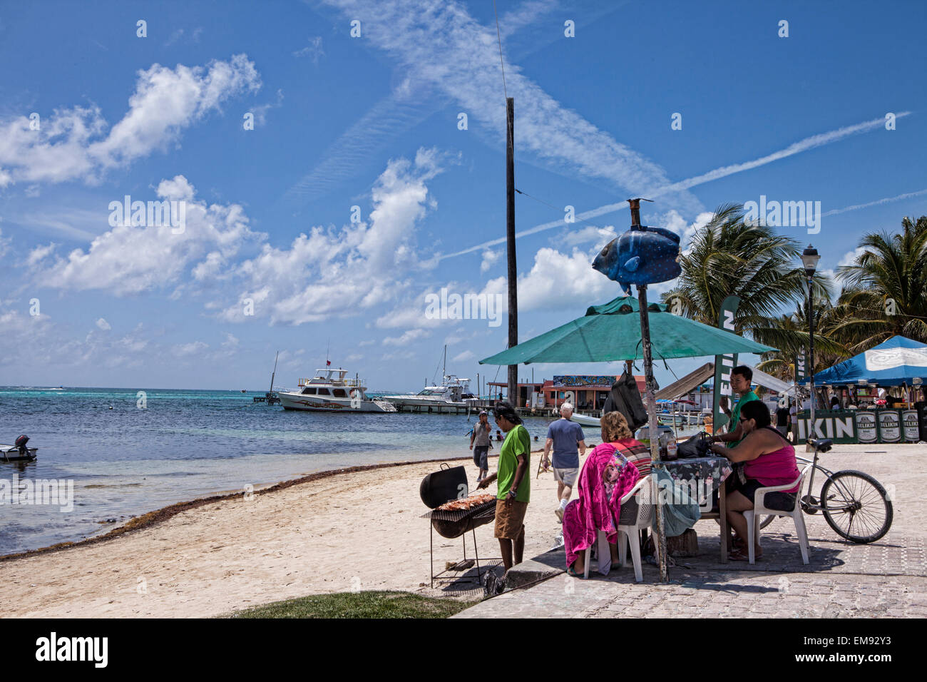 Family barbeque on the beach on Ambergris Caye, Belize, South America ...