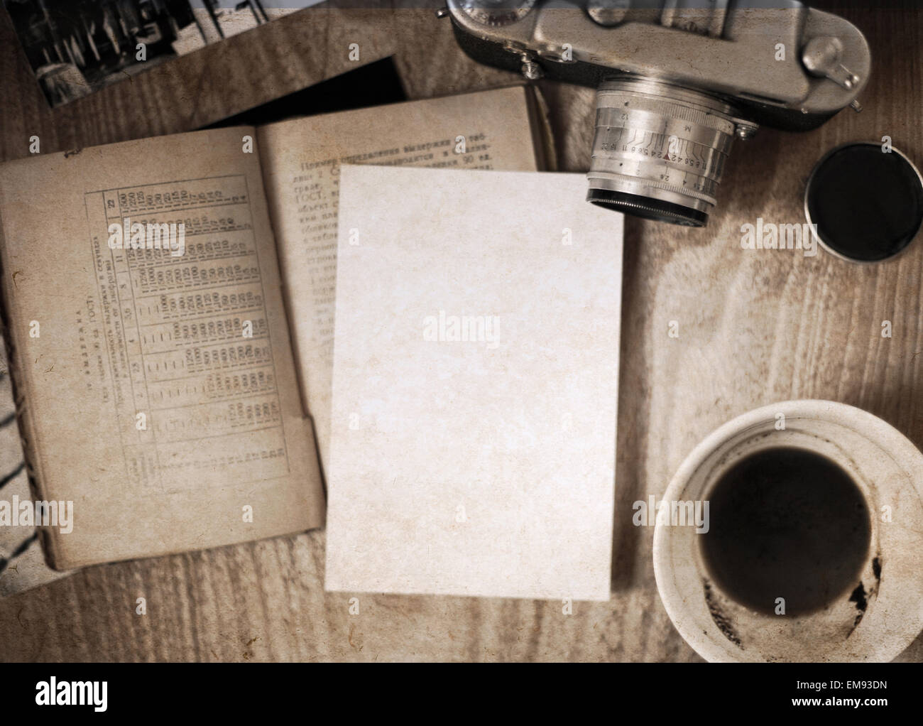 Artwork in retro style, old-fashioned camera, opened book, empty cup of ...